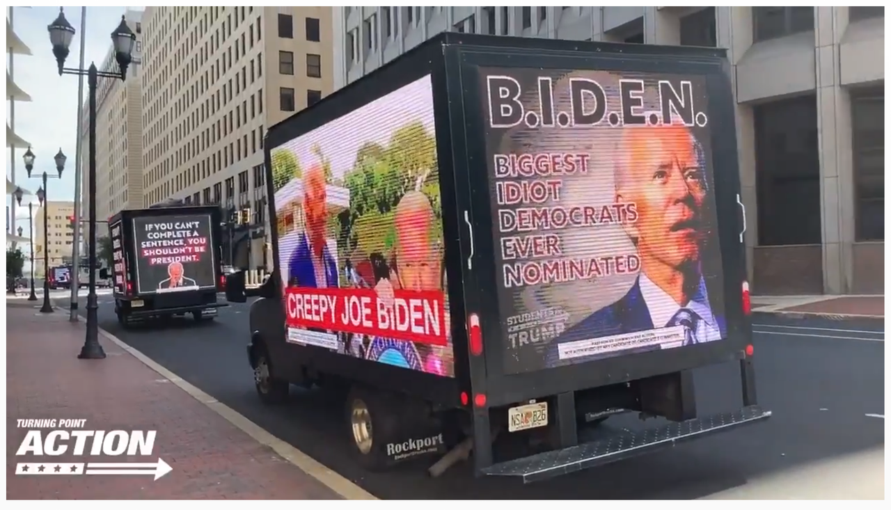 There are some creepy trucks driving around where Biden is speaking ...