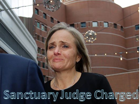 Massachusetts judge charged with helping immigrant escape courthouse to ...