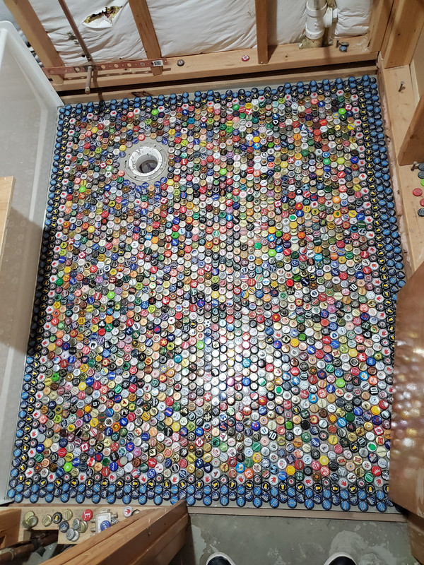 I FINALLY finished laying all the beer bottle caps for my basement ...