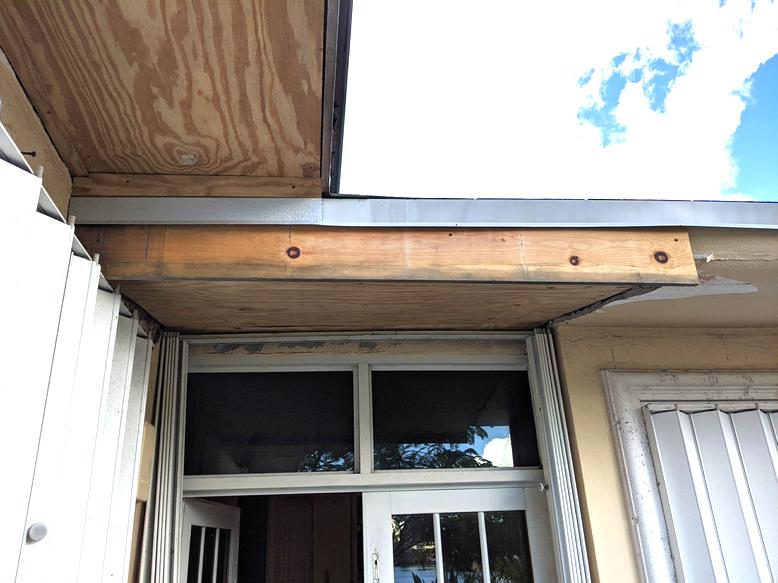 Transition from a straight plywood soffit to a curved plaster soffit ...