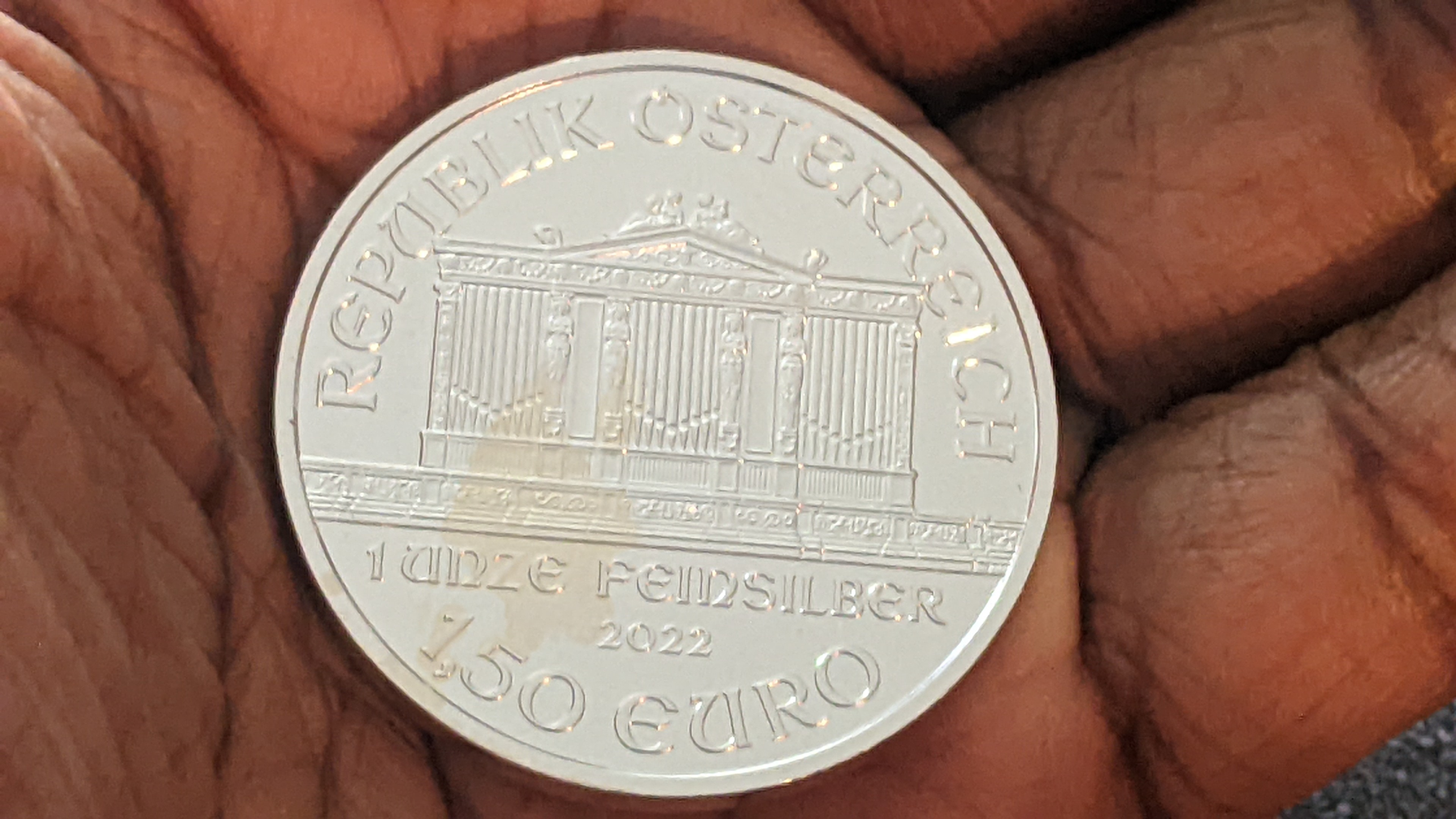 Yellow stain on silver coin. Is this the beginning of tarnish? : r ...