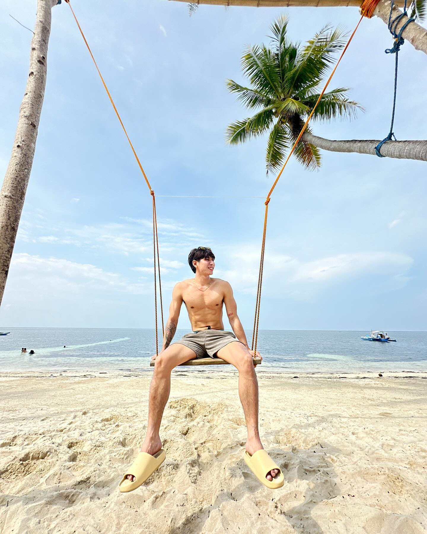 Photo by Mon Mendoza on December 14 2023 May be an image of 2 people hammock beach ocean and pa ...