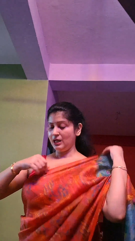 Hot Bengali lady Huge Breasts Cleavage and Deep navel in orange Saree ...