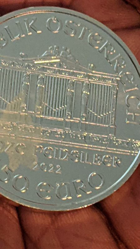 Yellow stain on silver coin. Is this the beginning of tarnish? : r ...