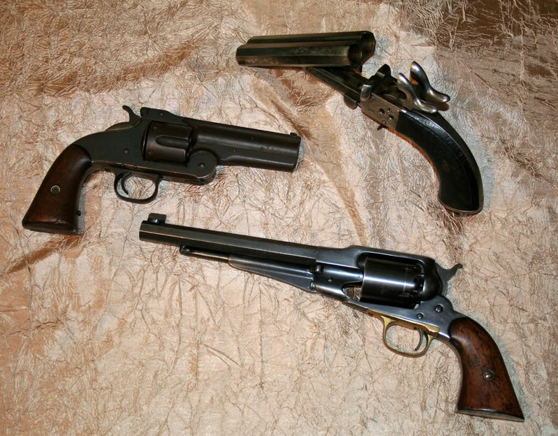 A few antique hand guns. | Single-Actions