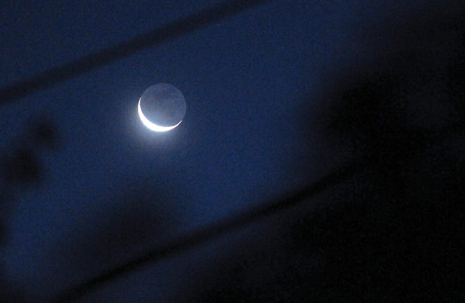 During a crescent moon phase, how does the non lit part of the moon ...