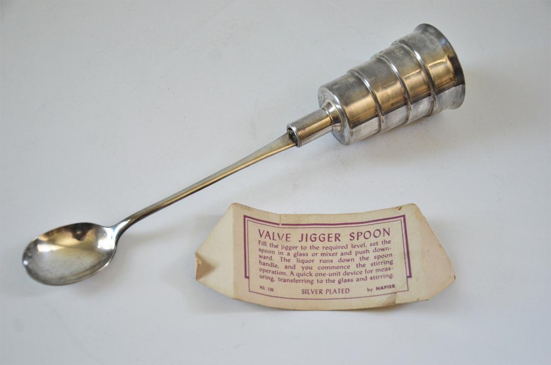 That's an antique "valve jigger spoon" that is possibly missing the cup ...