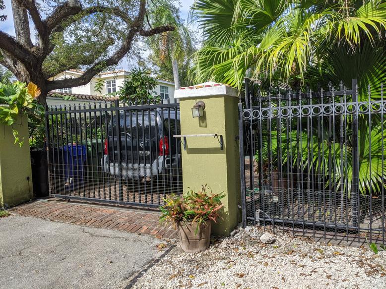 Rolling metal gate roller stuck and won't turn - DoItYourself.com ...