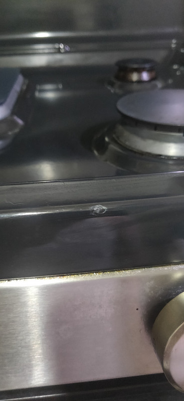 No idea how I did this. Nicked the metal/coating. GE adora stove. : r ...