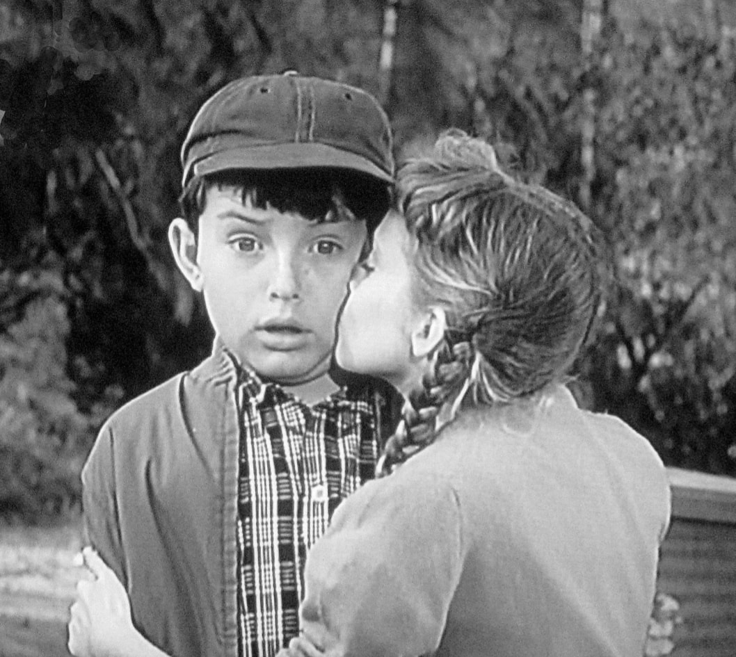 veronica cartwrright as violet rutherford kisses jerry mathers as the ...