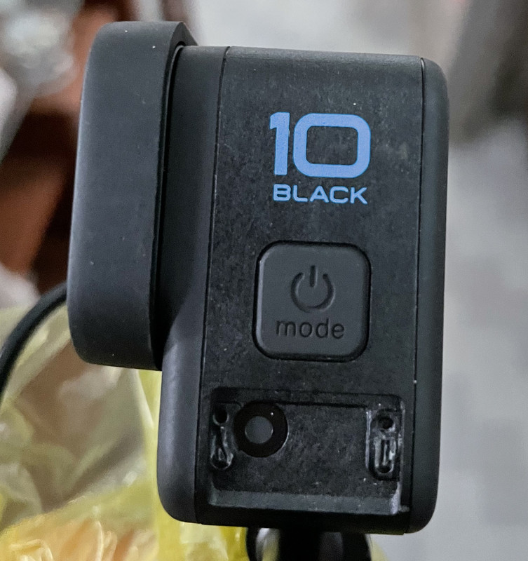 What is the small 'flap' directly under the power button on a GoPro ...