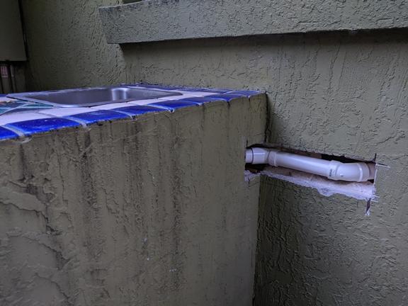 Pipe wrap/sleeve needed for pipe embedded in concrete?