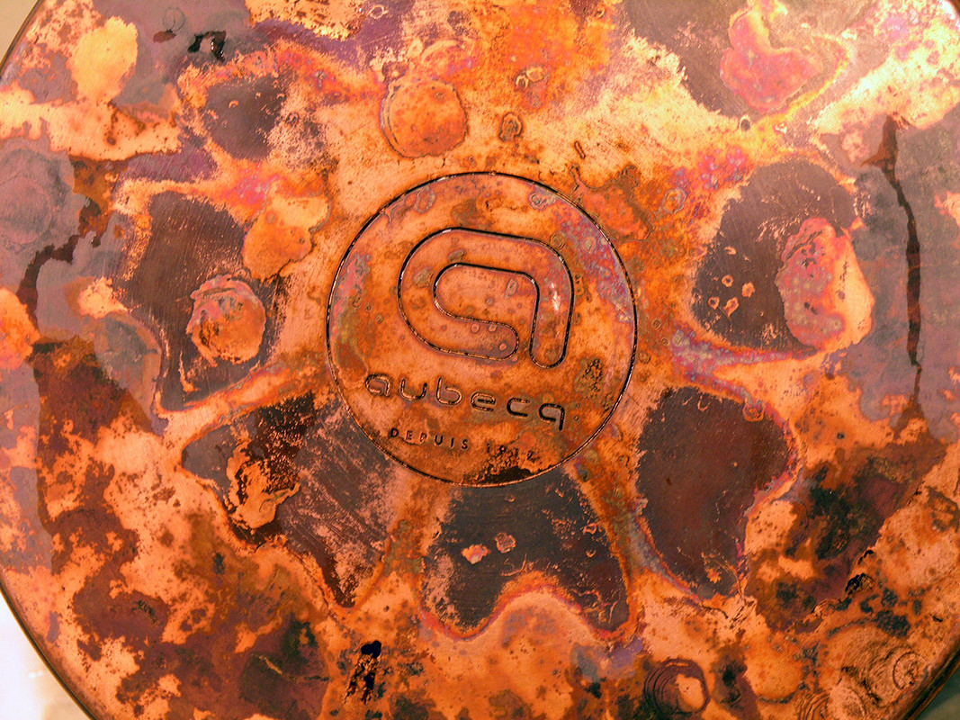 Burned my copper bottom cooking pot. Now it looks like an abstract ...